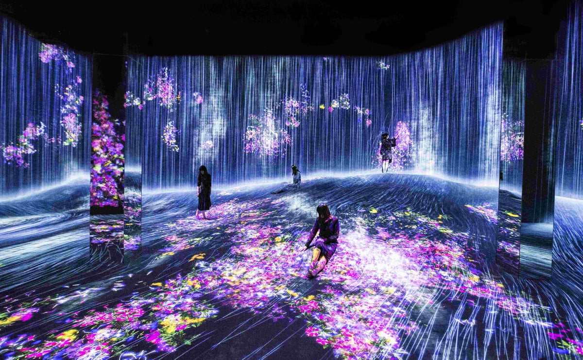 Universe of Water Particles on a Rock Hill where People Gather | teamLab